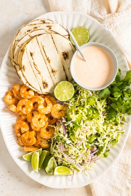 Shrimp Tacos with Cabbage Slaw and Spicy Cream | Skinnytaste