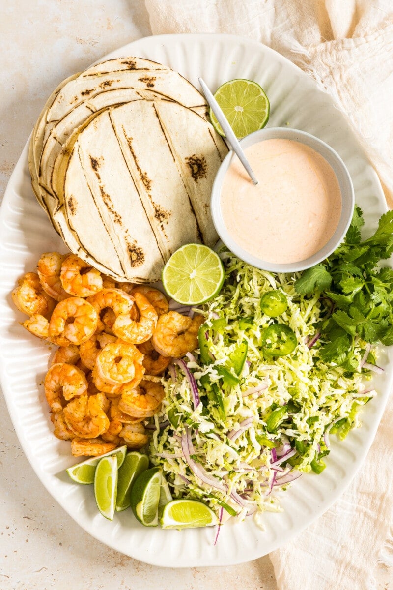 Shrimp Tacos with Cabbage Slaw and Spicy Cream | Skinnytaste