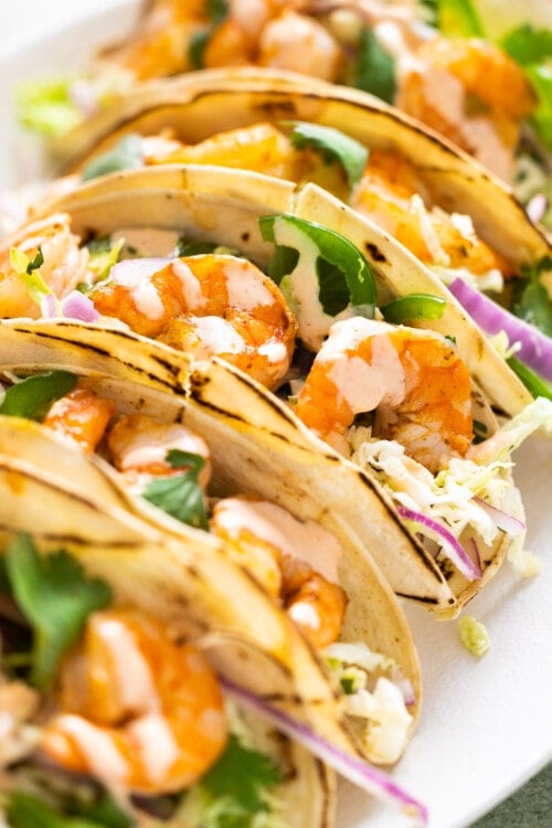 Shrimp Tacos with Cabbage Slaw and Spicy Cream | Skinnytaste